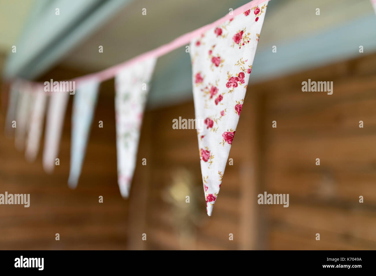Floral bunting hanging from an English summer house in the UK Stock ...