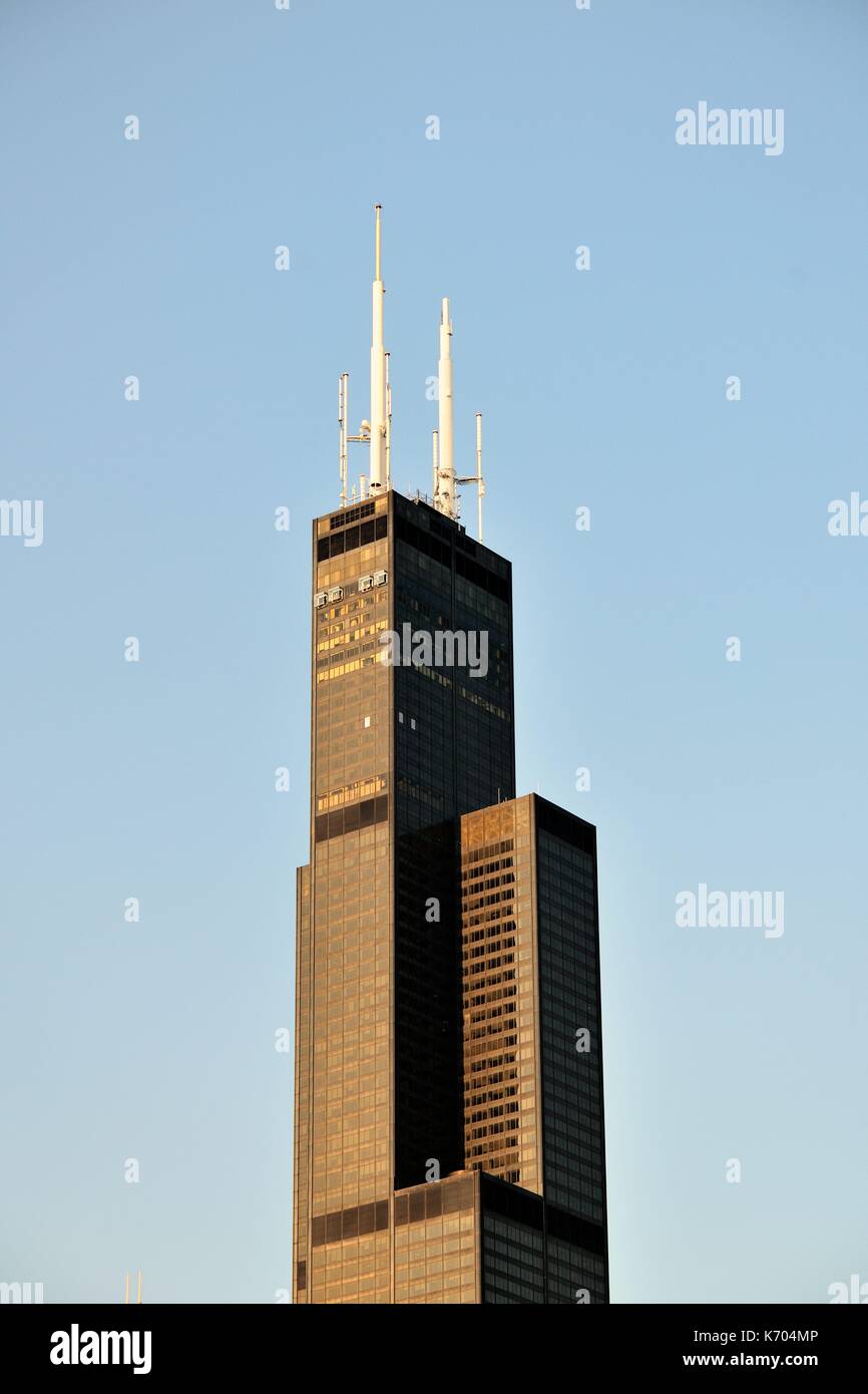 Willis Tower (formerly Sears Tower) reflects the late day's rays of the sun as it begins its ...