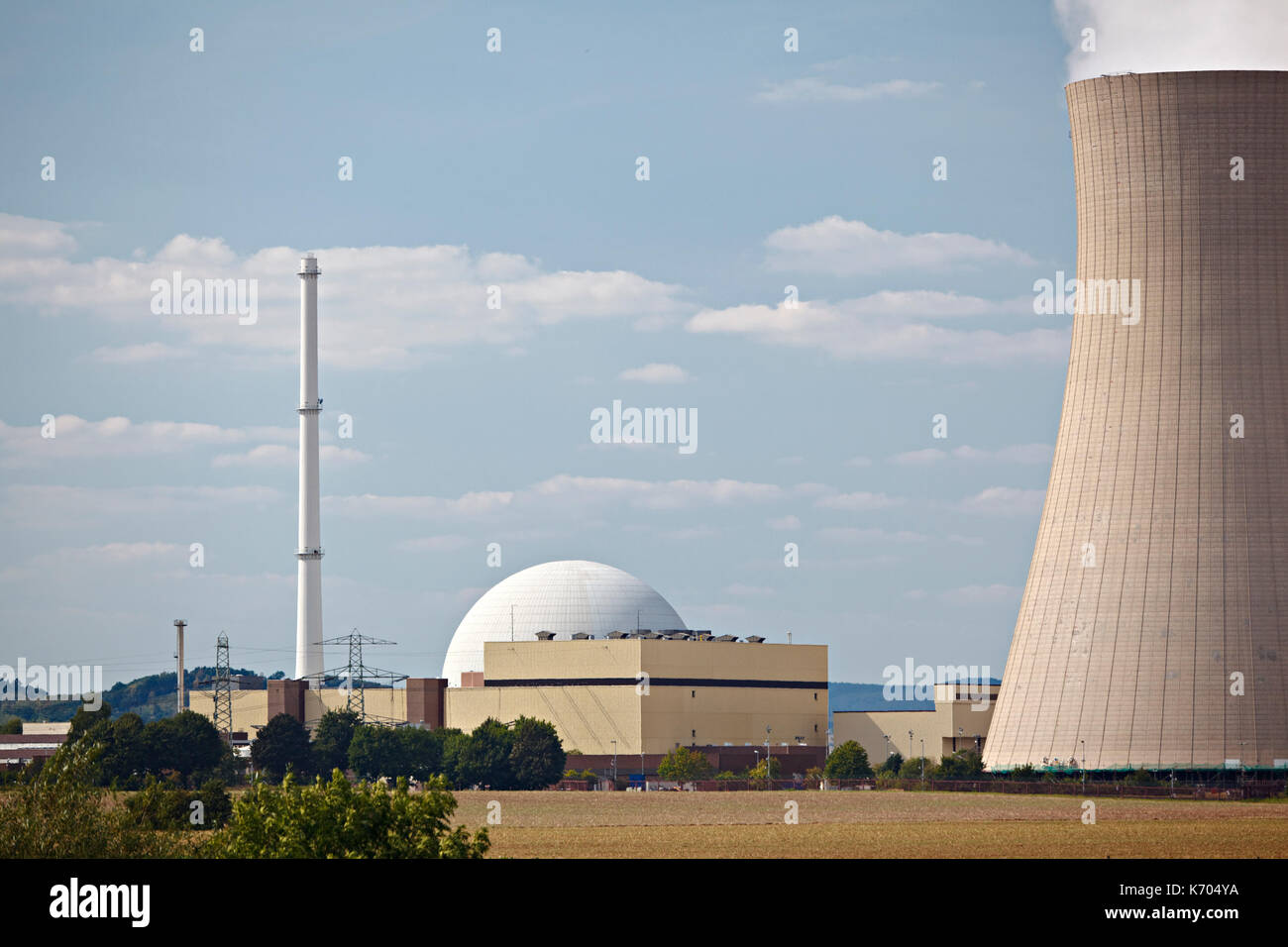 Reactor building and smoke stack of a nuclear power station next to the ...
