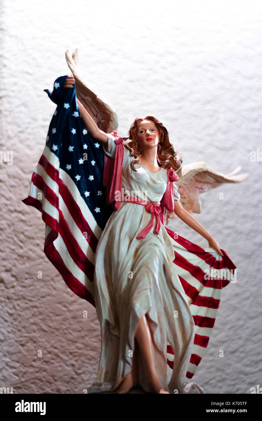 Angel holding american flag hi-res stock photography and images - Alamy