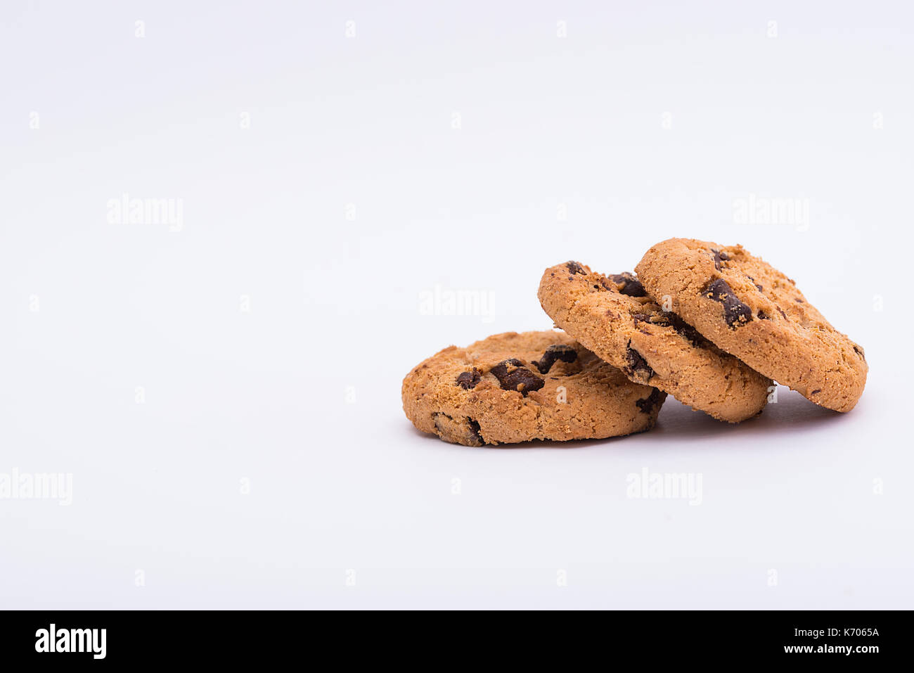 Three chocolate chip cookies isolated on a white background Stock Photo ...