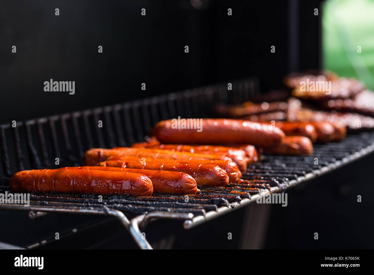 Hotdogs on barbecue grill Stock Photo - Alamy