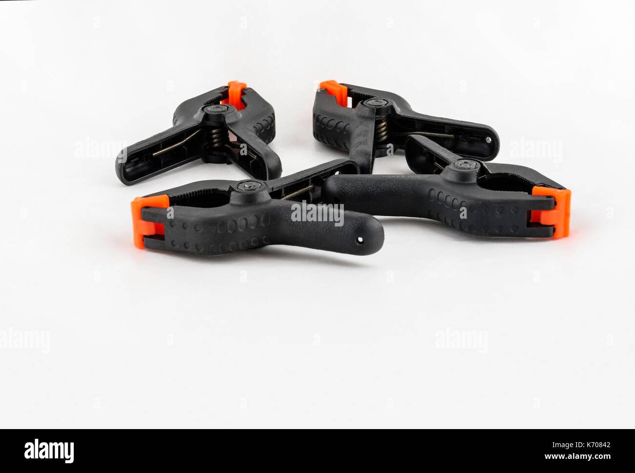 Four heavy duty clamps on a white background. Silo, cutout, cut out ...