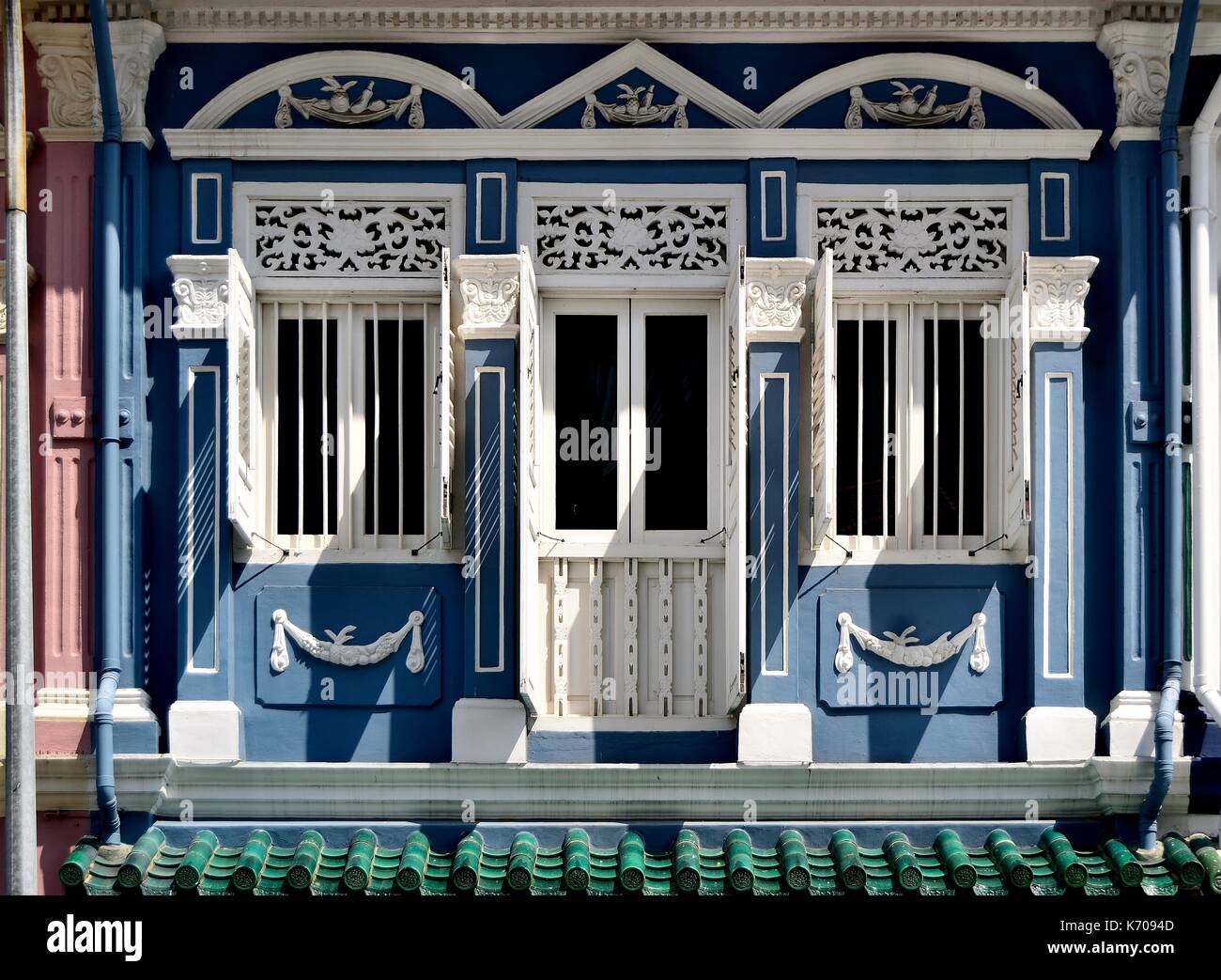 Traditional shop house exterior with blue and white facade, white ...