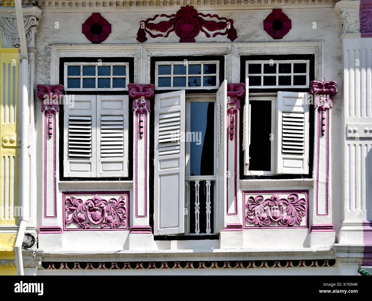 Traditional shop house exterior with white and pink facade, white ...
