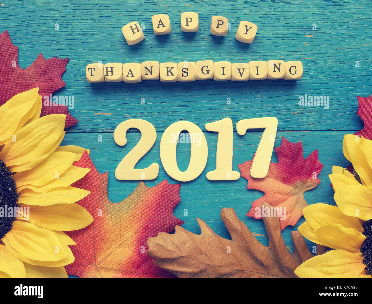 Thanksgiving background on blue weathered wood with leaves and ...