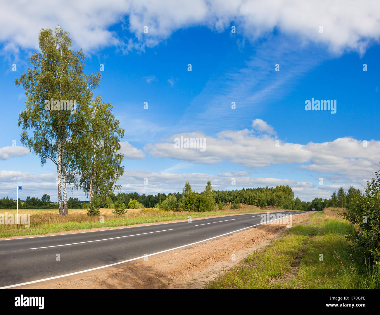 summer rural landscape panorama with road,forest,field and blue sky ...