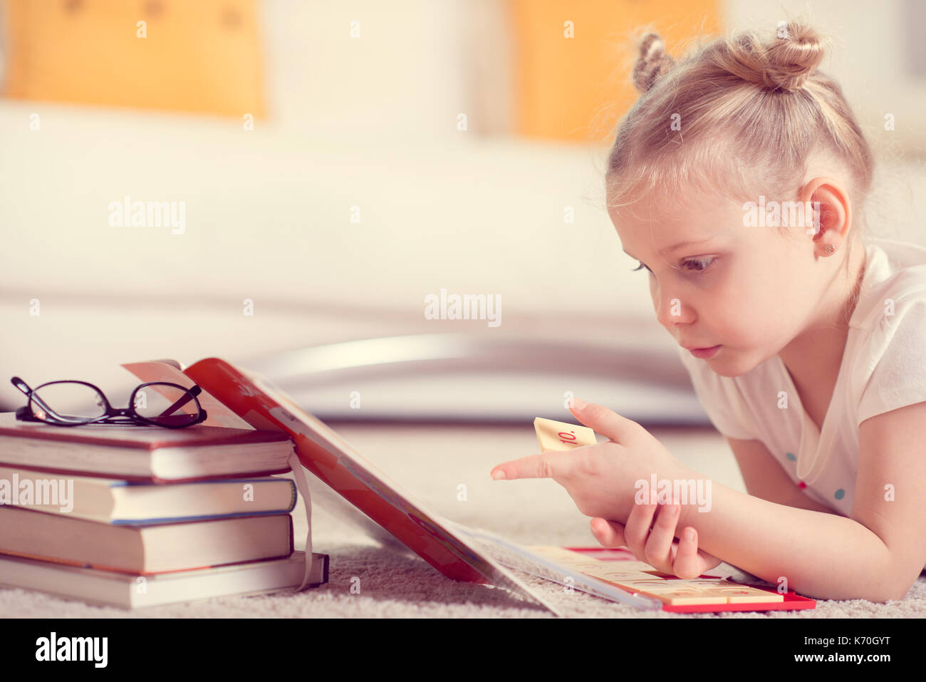 Cute little girl study mathematics at home Stock Photo - Alamy