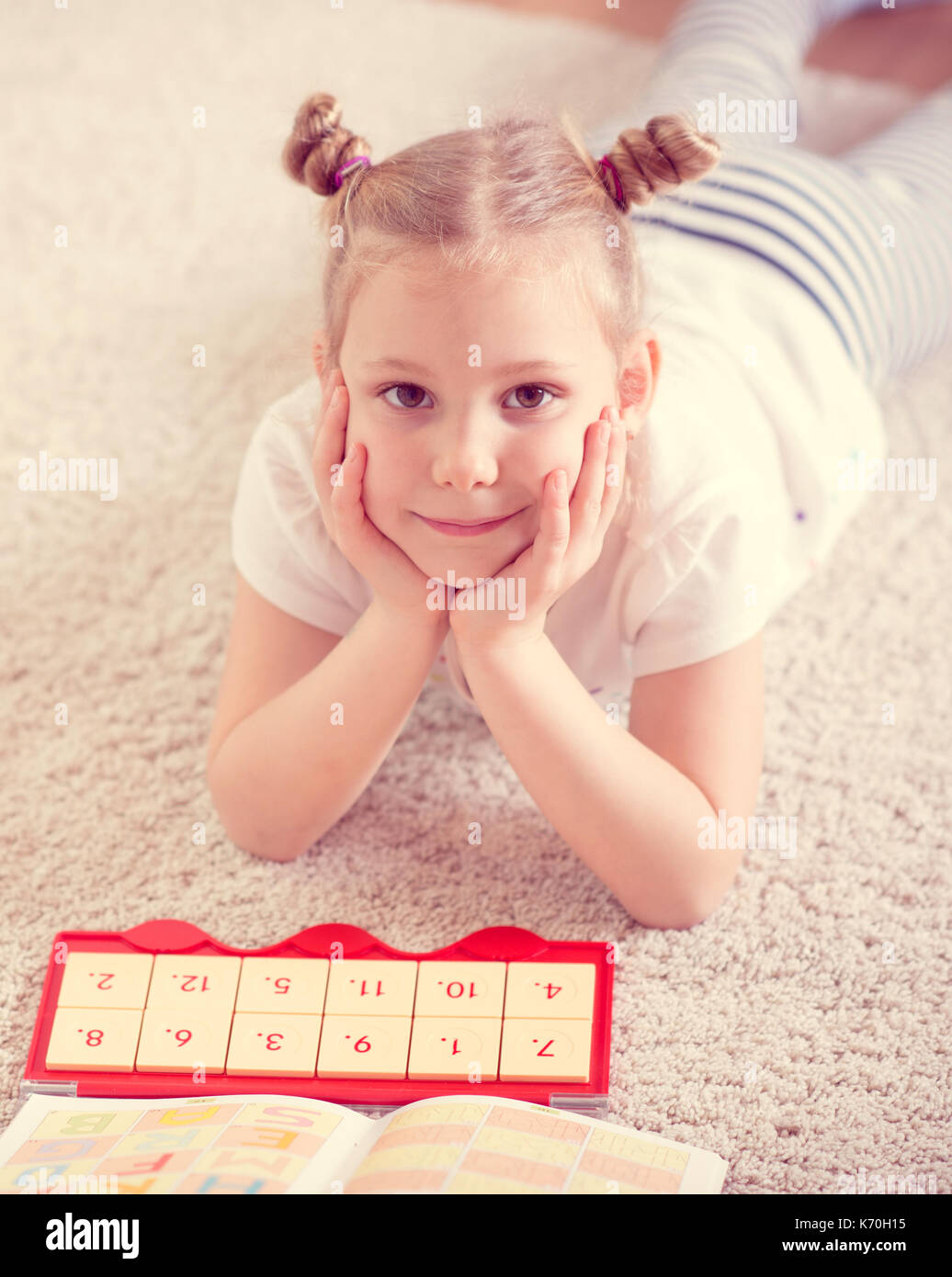 Cute little girl study mathematics at home Stock Photo - Alamy