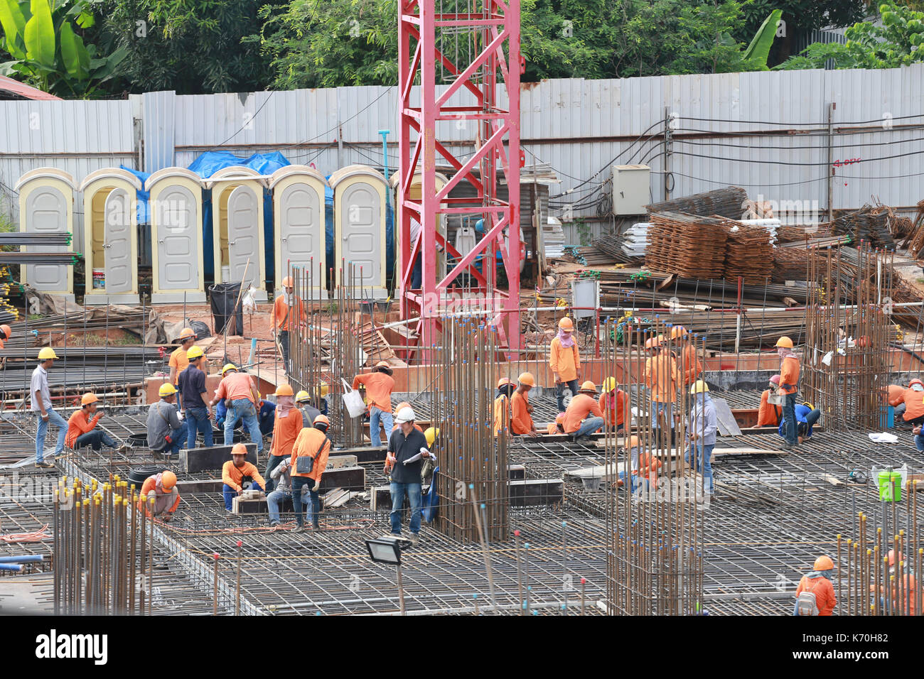 Construction site and Worker is working in Tall buildings Stock Photo ...