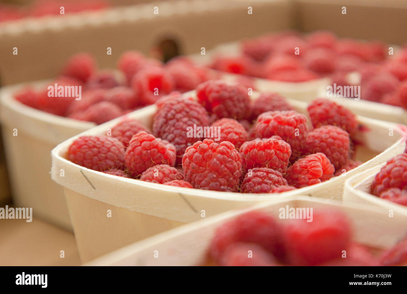 boxes of red fresh raspberries at a market stand Stock Photo - Alamy