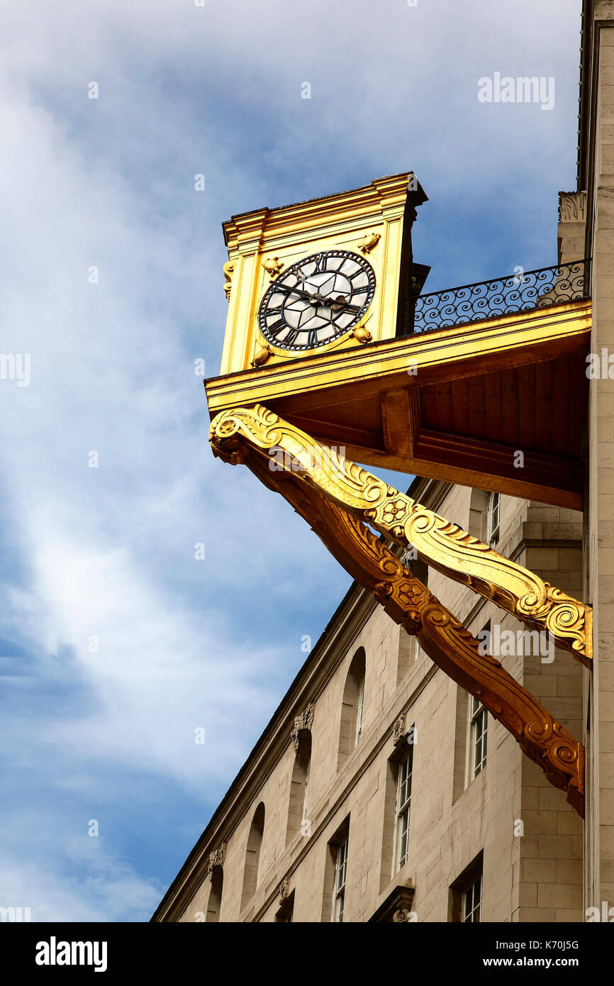 Gold ornate clock on leeds civic hall building at millennium square ...