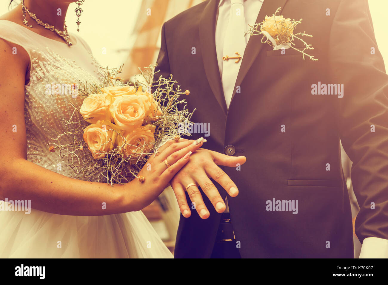 Wedding couples hands ring bouquet hi-res stock photography and images ...