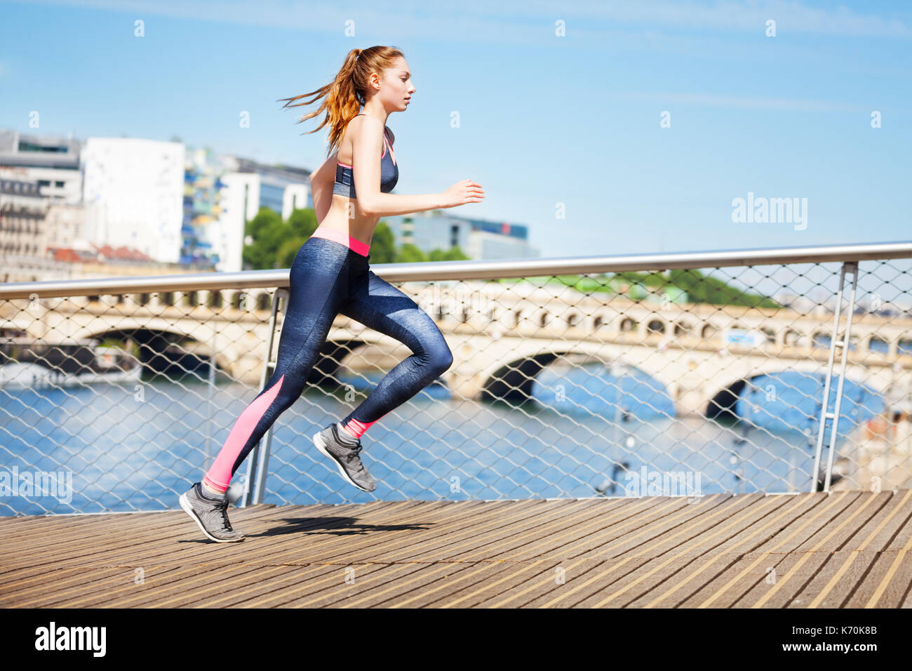 Woman running across street hi-res stock photography and images - Alamy