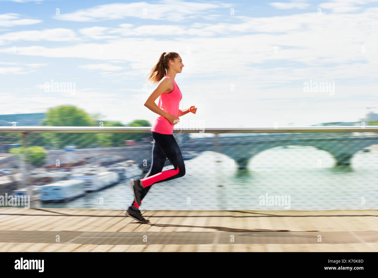 Woman running across street hi-res stock photography and images - Alamy