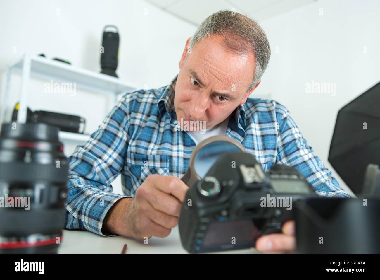 fixing the camera Stock Photo - Alamy