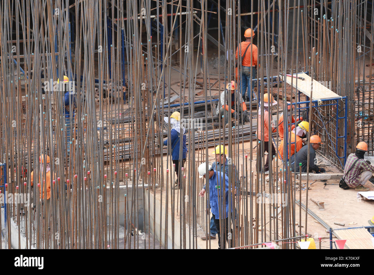 Construction site and Worker is working in Tall buildings Stock Photo ...