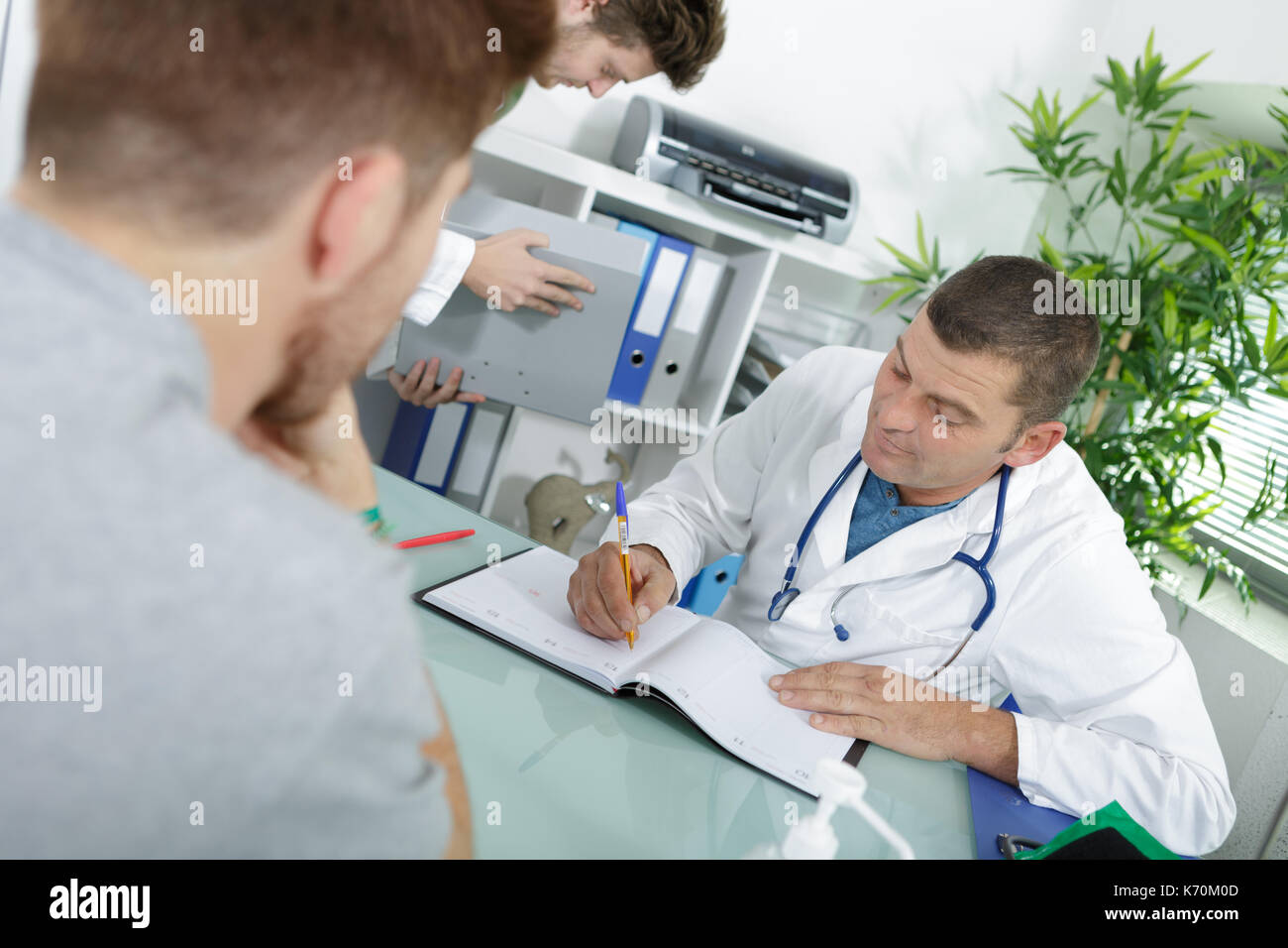 man as doctor or physician during consultation at his office Stock ...