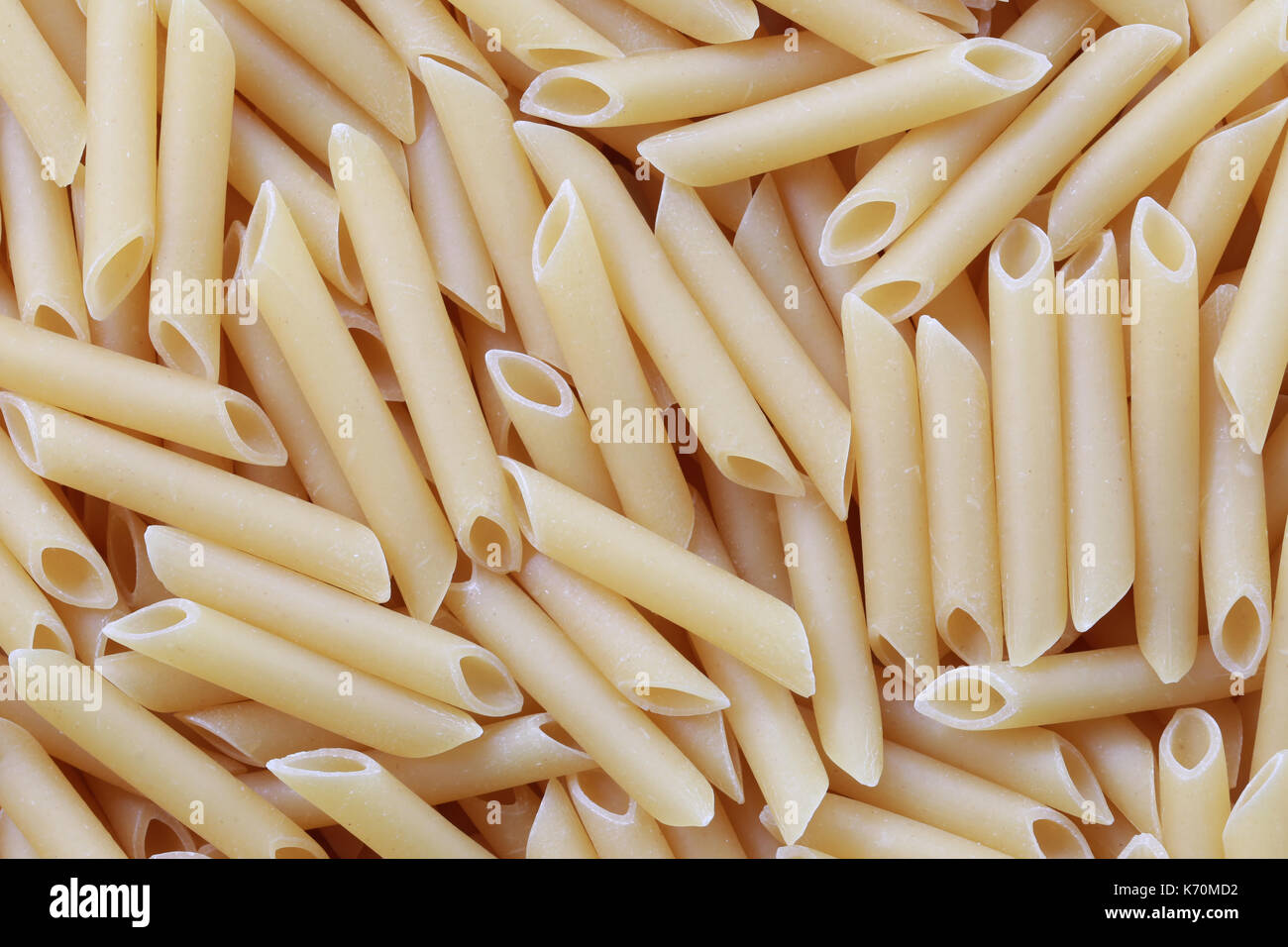 Raw Macaroni background for design food backdrop Stock Photo - Alamy