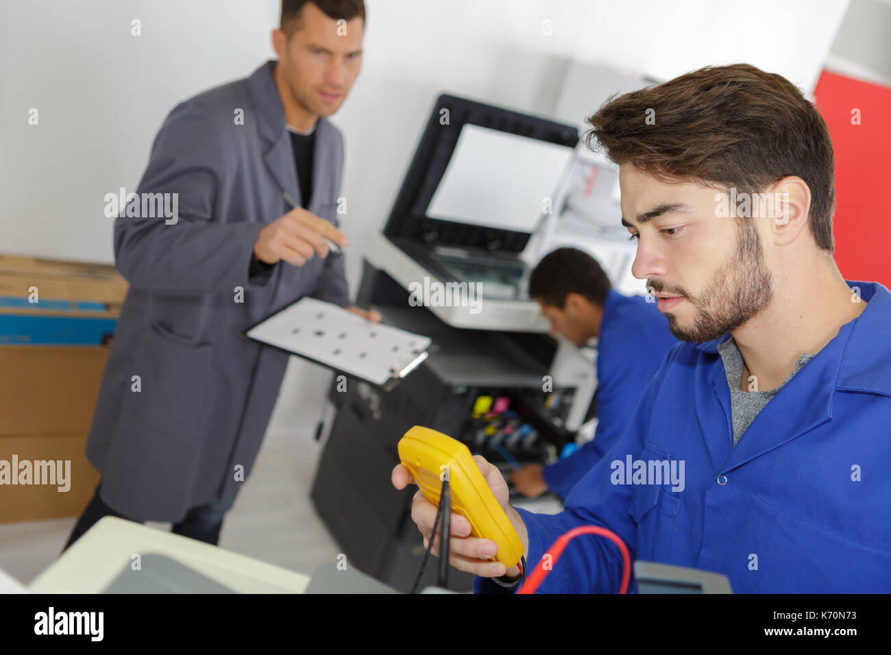 young electrician with multimeter during class Stock Photo - Alamy