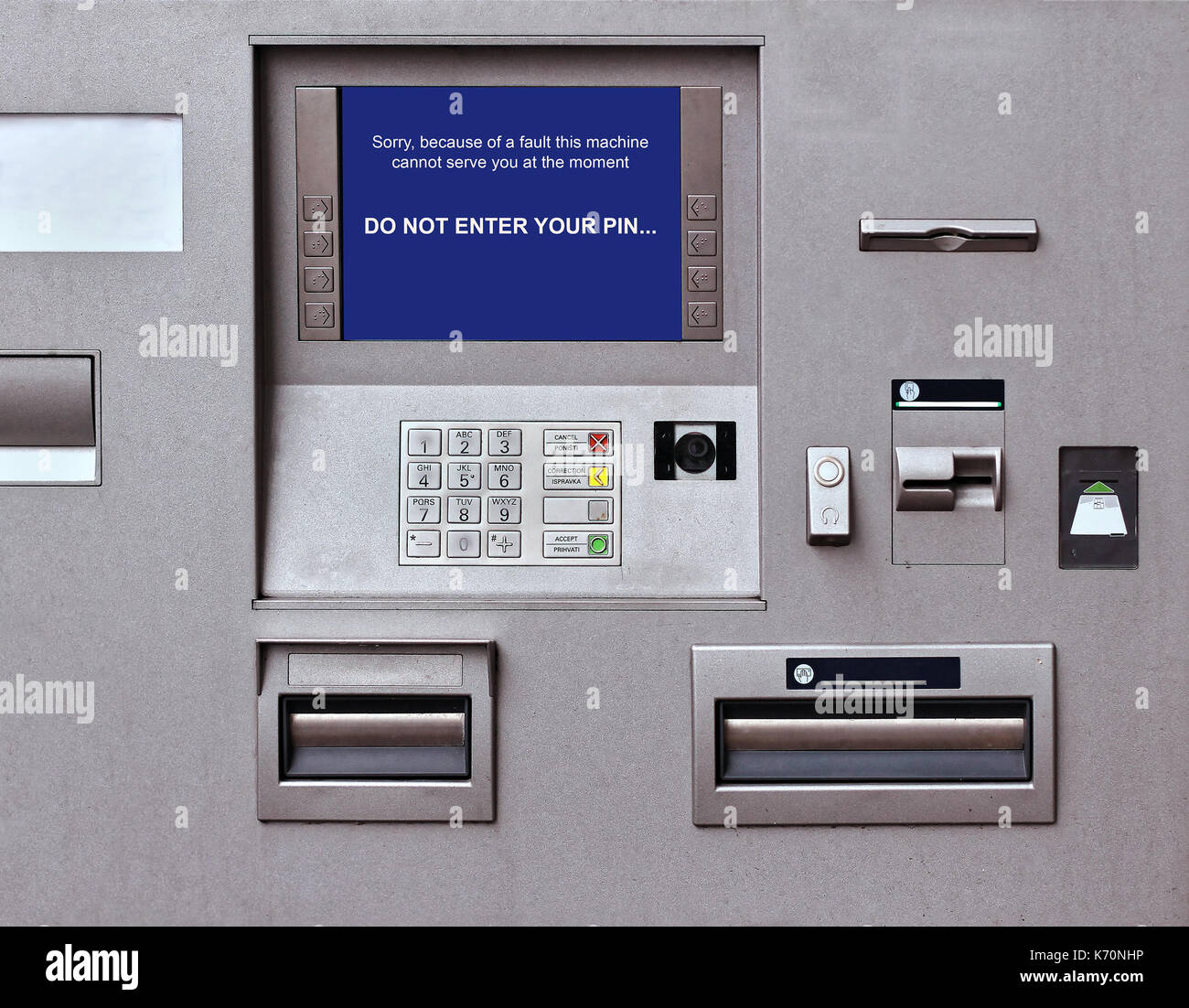 Banking machine with faulty warning sign on screen Stock Photo - Alamy