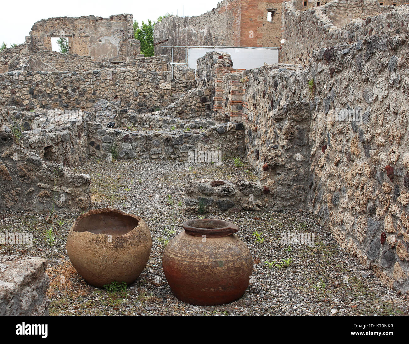 Ancient cracked pottery jars in old ruined archeology site Stock Photo ...