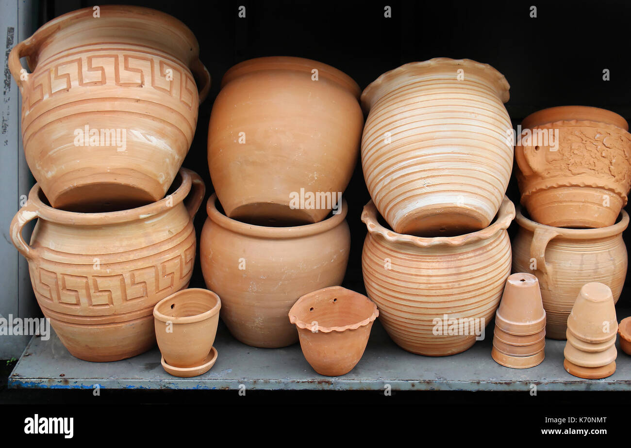 Art and craft terracotta clay containers pile Stock Photo - Alamy