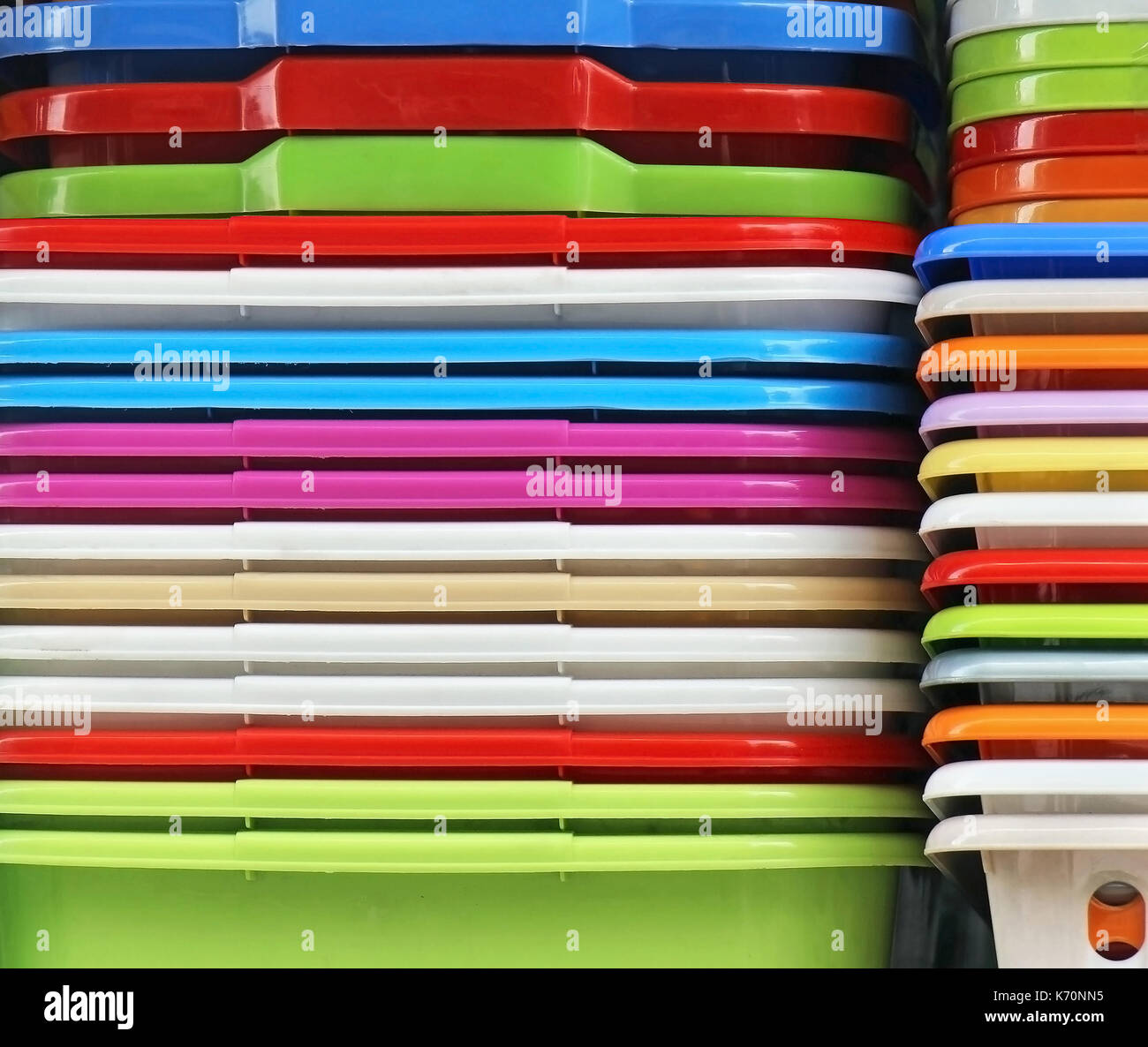 Colorful stack of plastic containers detail background Stock Photo - Alamy