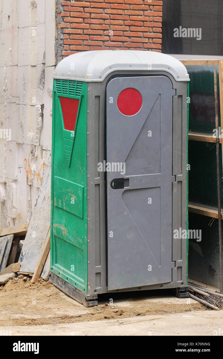 Portable mobile public toilet outside construction site Stock Photo - Alamy