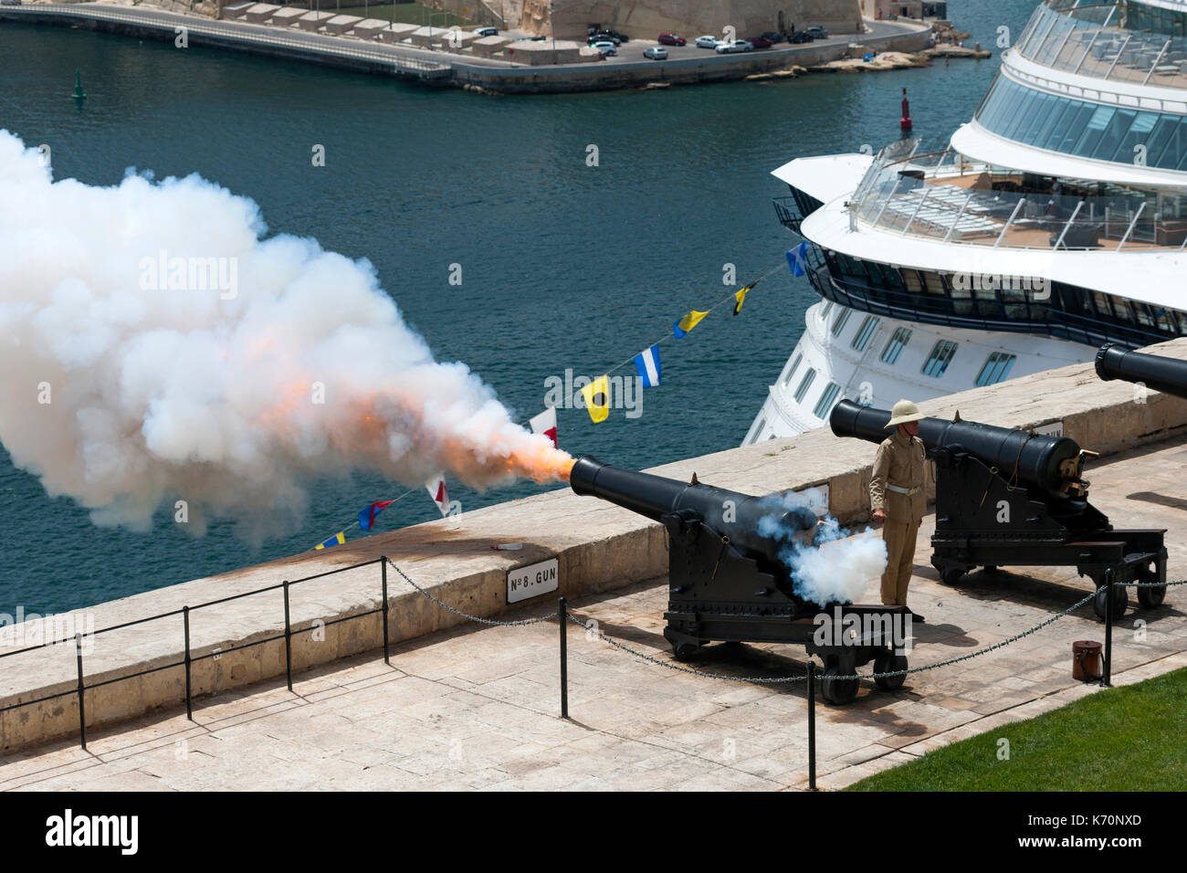 The noon cannon being fired from the Saluting Battery in Valletta, the ...