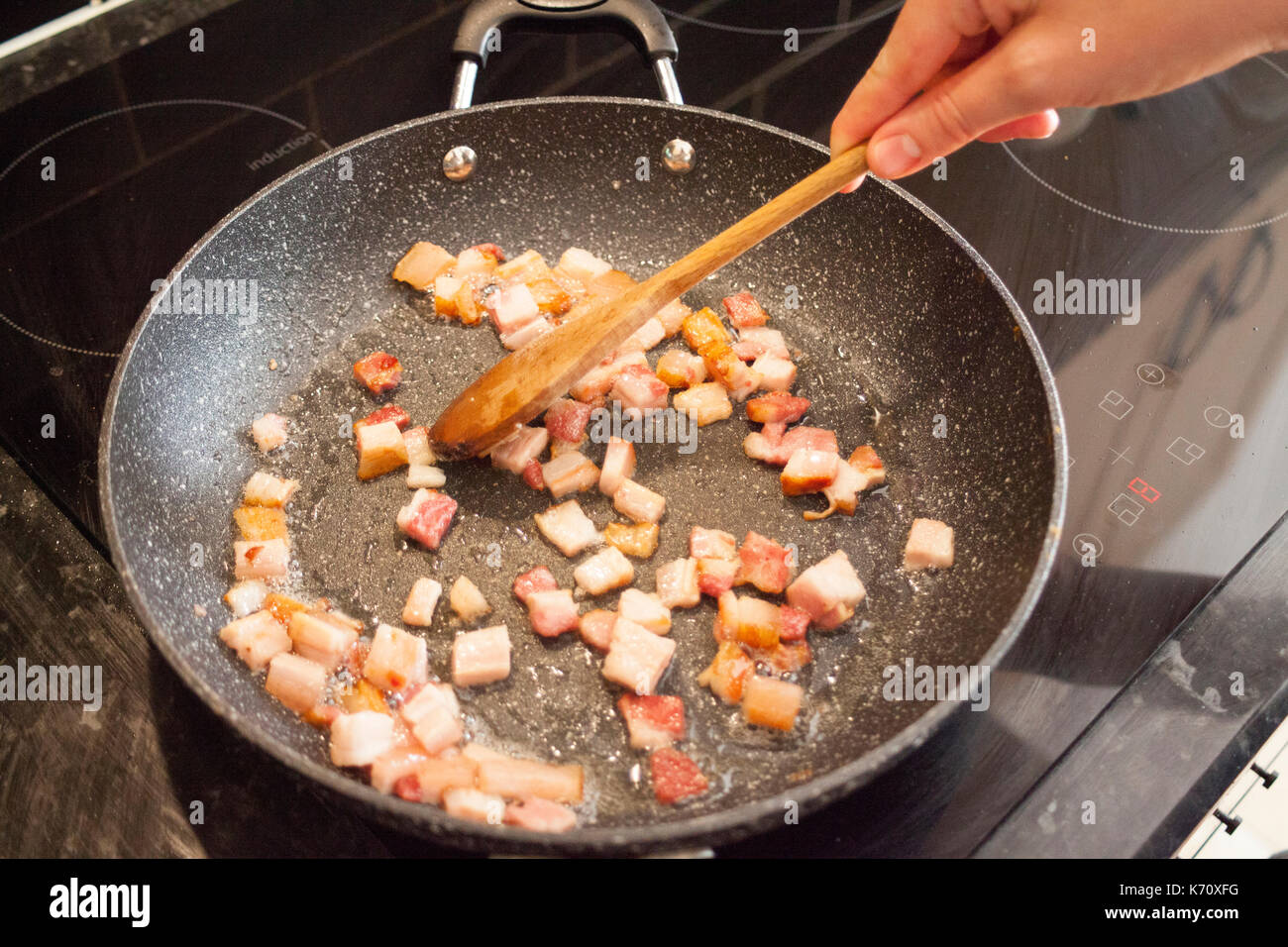 Crispy bacon on the frying pan Stock Photo - Alamy