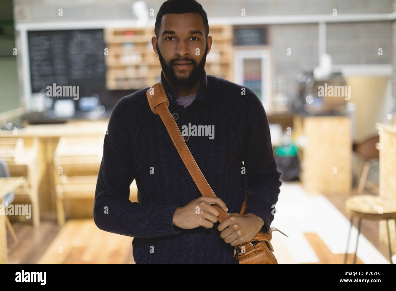 Man standing in cafe hi-res stock photography and images - Alamy
