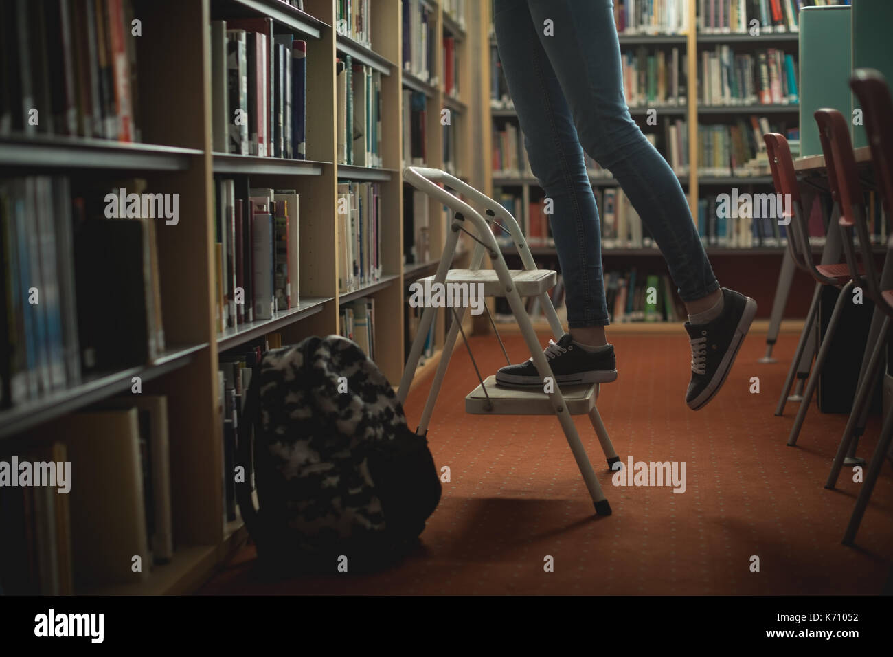 Woman ladder library hi-res stock photography and images - Alamy