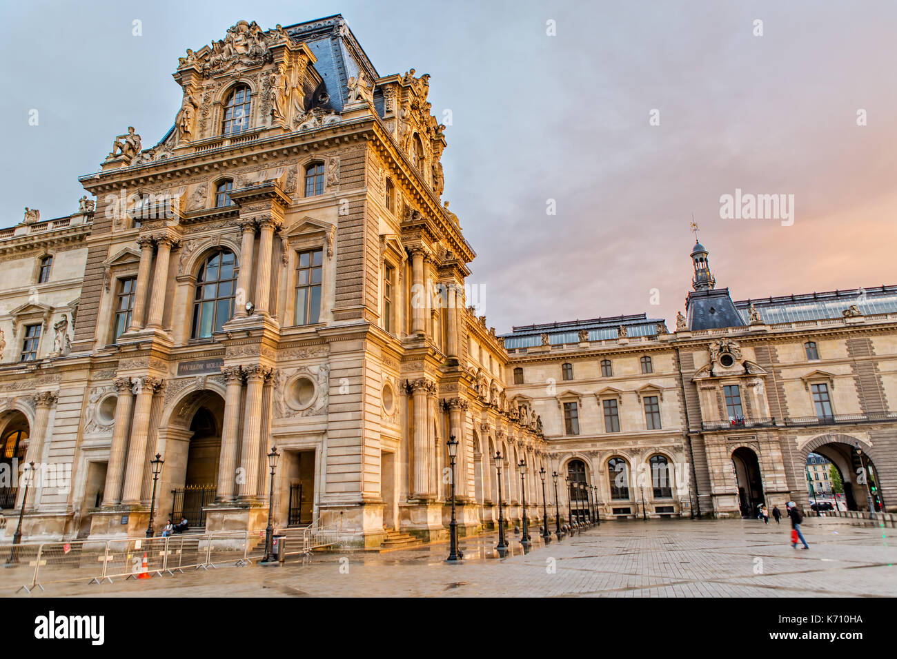 Sunset over a Wing on the Louvre Museum in Paris Stock Photo - Alamy
