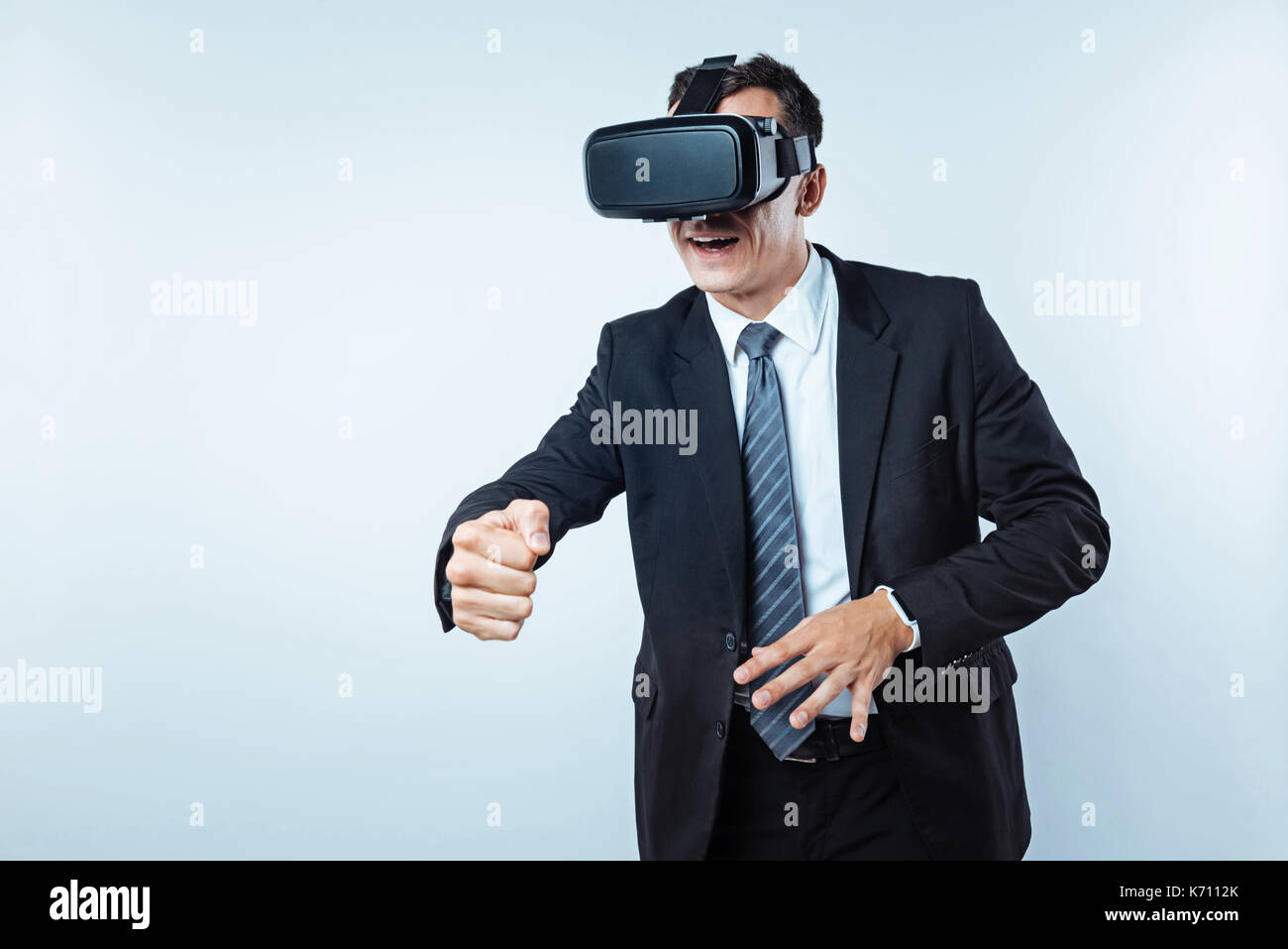 Office employee playing virtual reality games Stock Photo - Alamy
