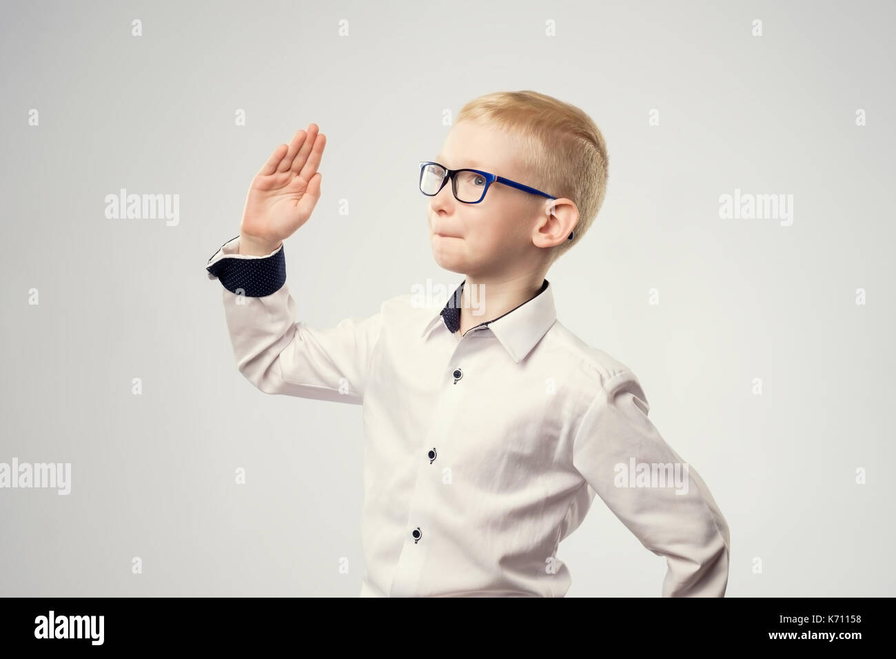 Child raised hand hi-res stock photography and images - Alamy