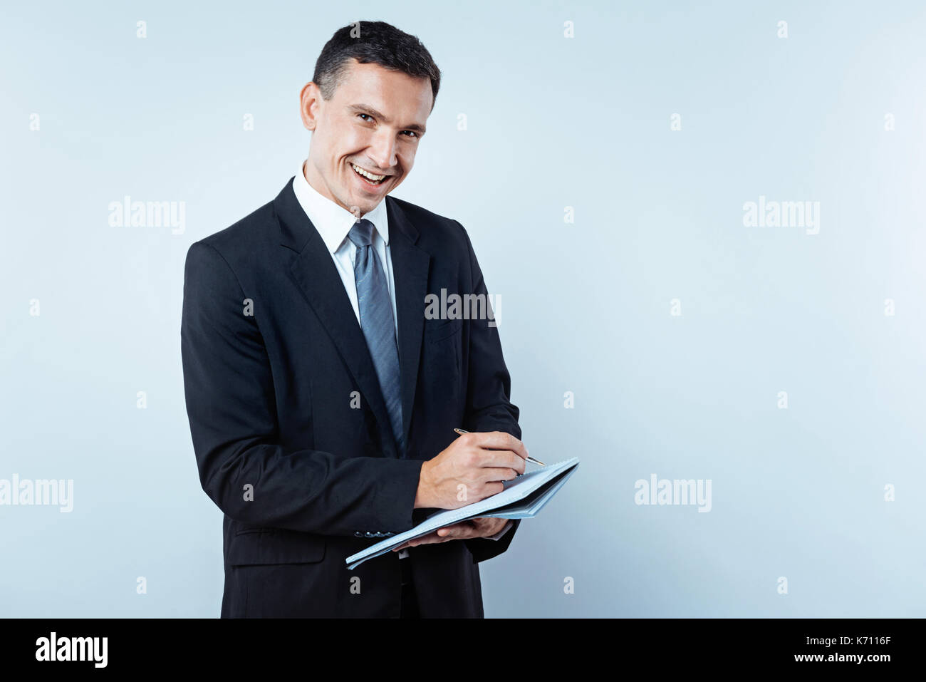 Man writing something in notebook hi-res stock photography and images ...
