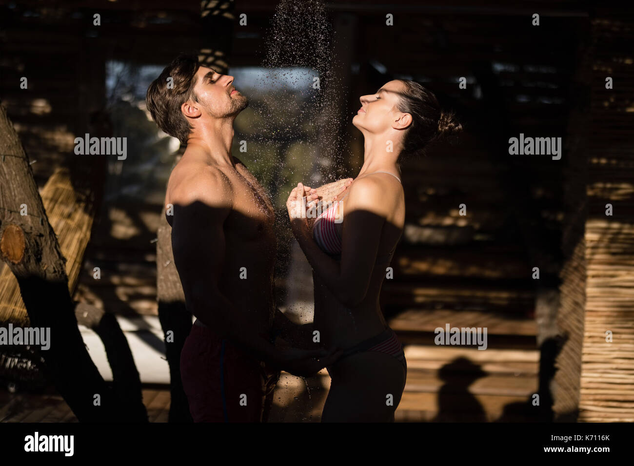 Couple taking bath in shower during safari vacation Stock Photo - Alamy