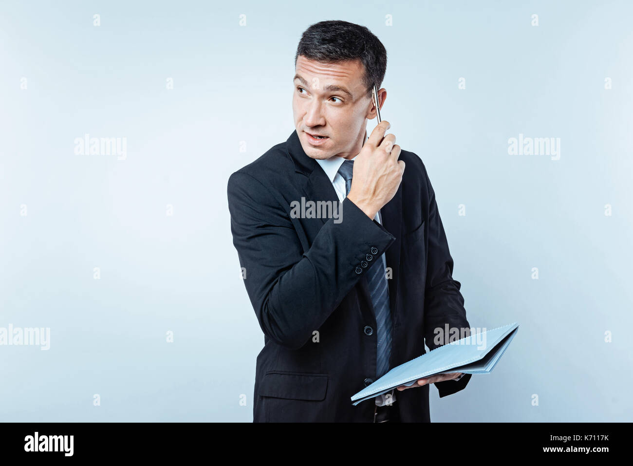 Confused man of business thinking over problem solution Stock Photo - Alamy