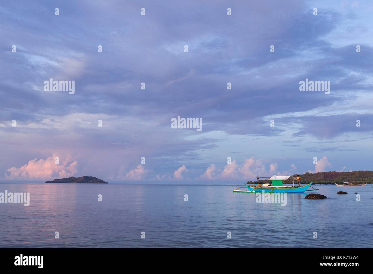Philippines, Palawan, Dumaran Island, Araceli, sunrise on the bay Stock ...
