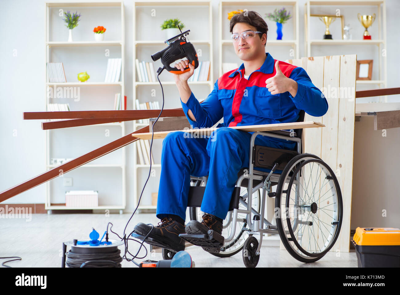Disabled man working with circular saw Stock Photo - Alamy