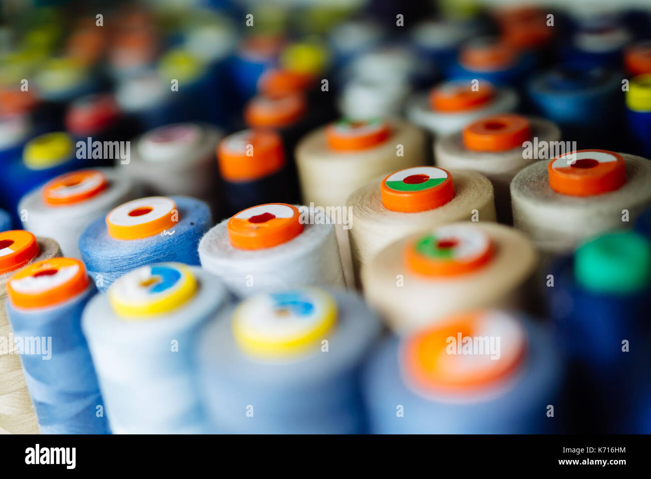 Colorful thread spools used in fabric industry Stock Photo - Alamy