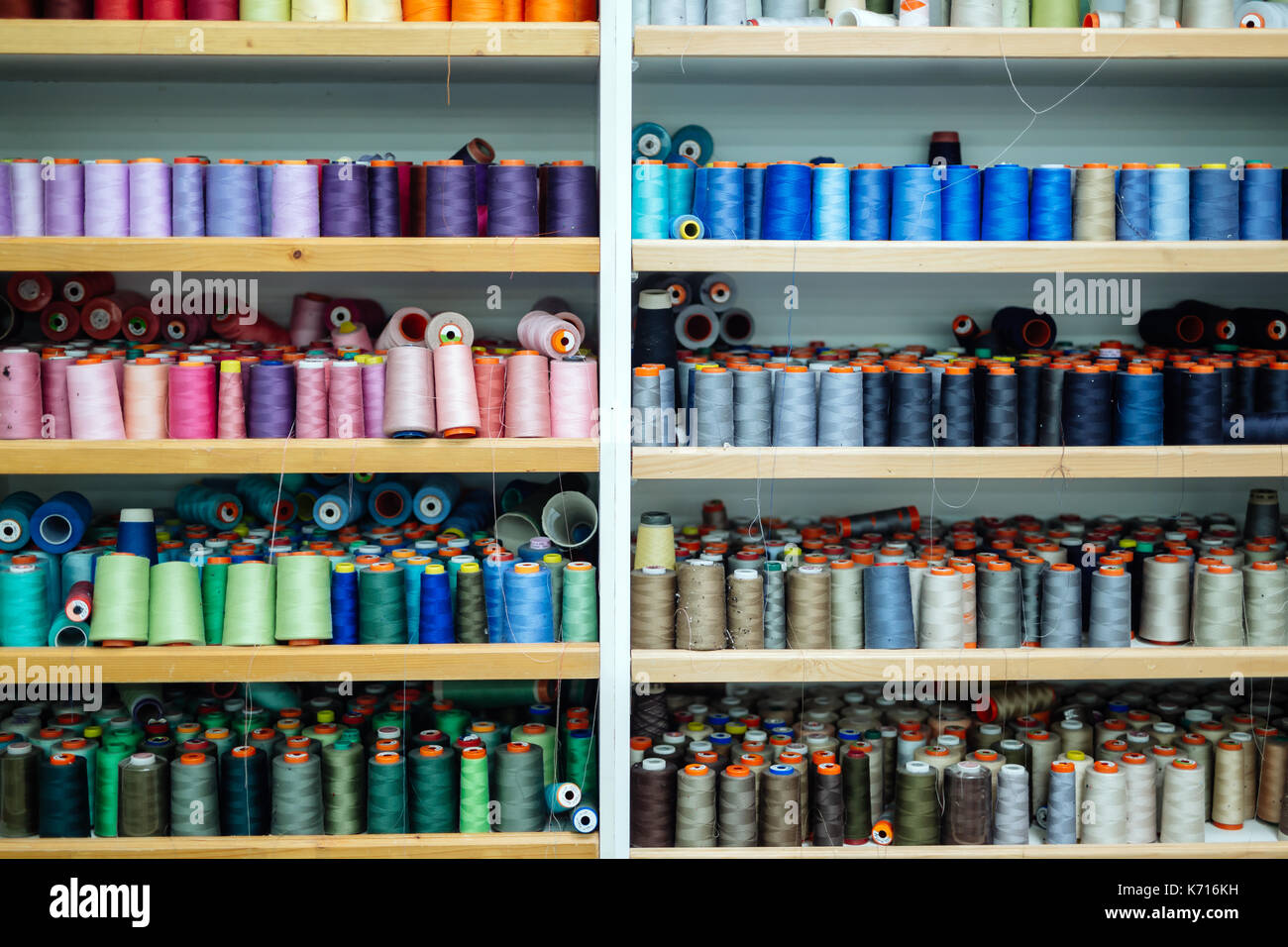 Colorful thread spools used in fabric industry Stock Photo - Alamy