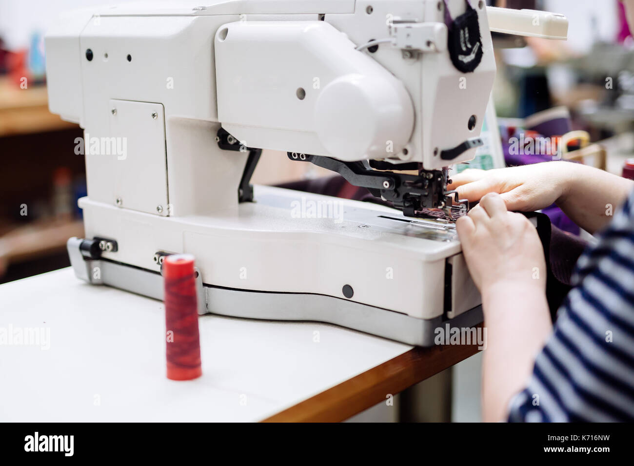 Woman working in textile industry Stock Photo - Alamy