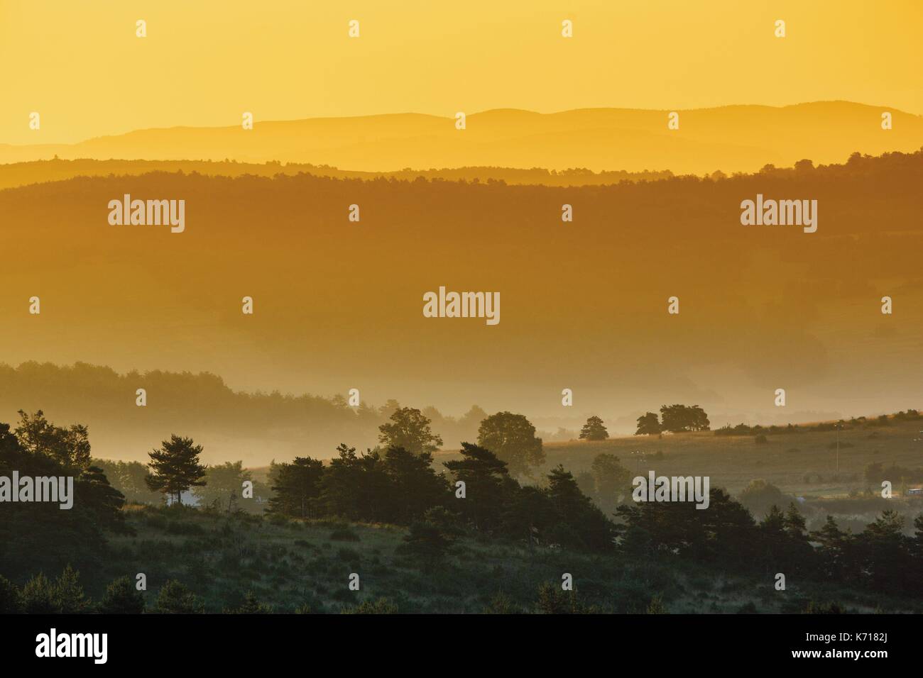 France, Aveyron, Golden haze landscape sun Stock Photo - Alamy