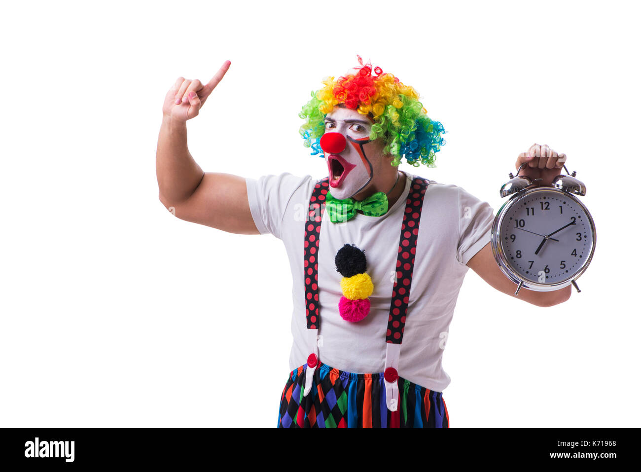 Funny clown with an alarm clock isolated on white background Stock ...