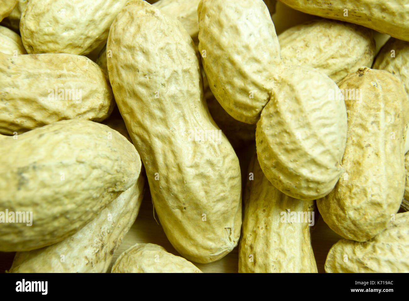 Close up of natural raw uncooked peanuts in the shell Stock Photo - Alamy