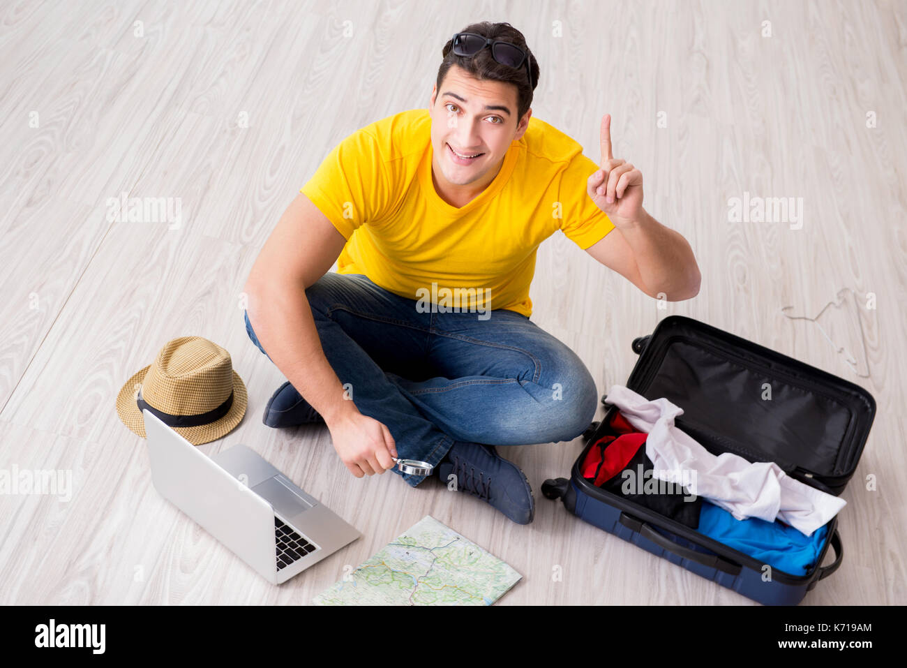 Man planning his vacation trip with map Stock Photo - Alamy