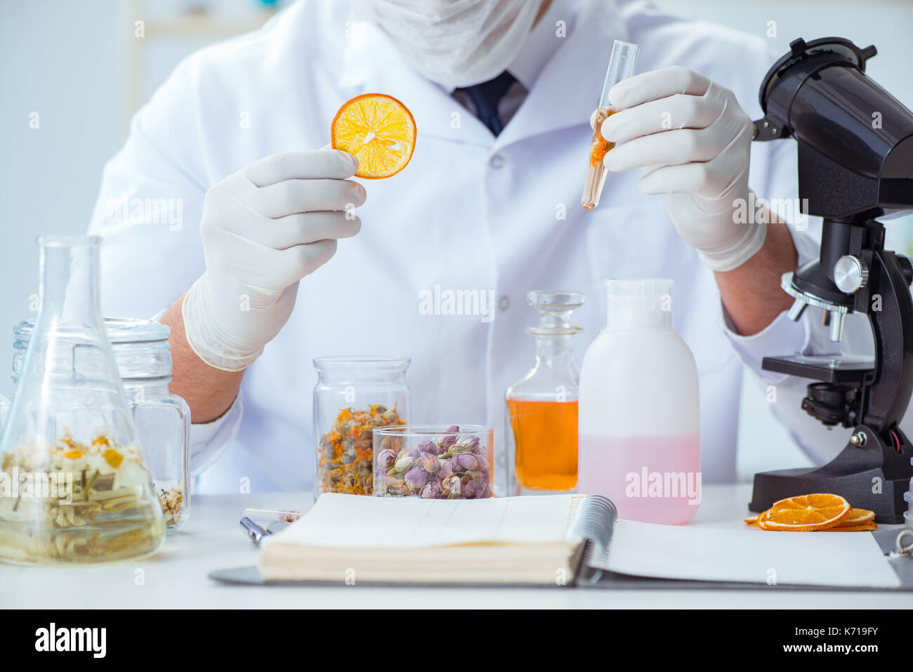 Chemist mixing perfumes in the lab Stock Photo - Alamy