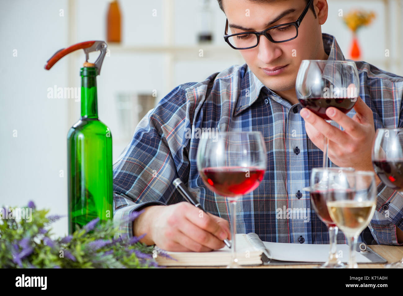 Professional sommelier tasting red wine Stock Photo - Alamy